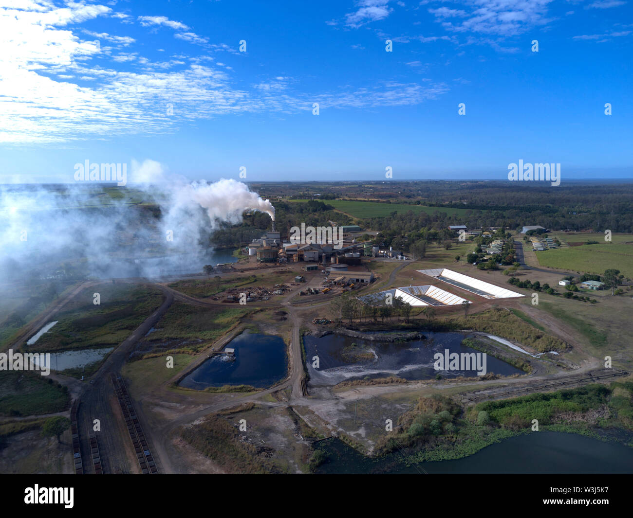 Aerial of factory processing the local sugar cane crop at the Isis ...