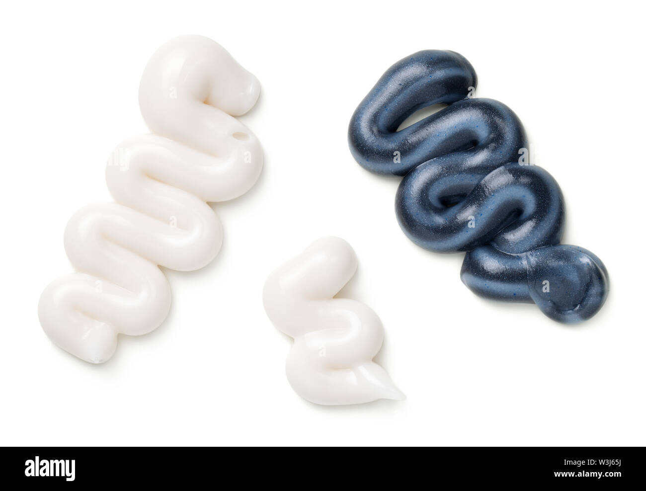 White and black toothpaste isolated on white background. Top view, flat ...