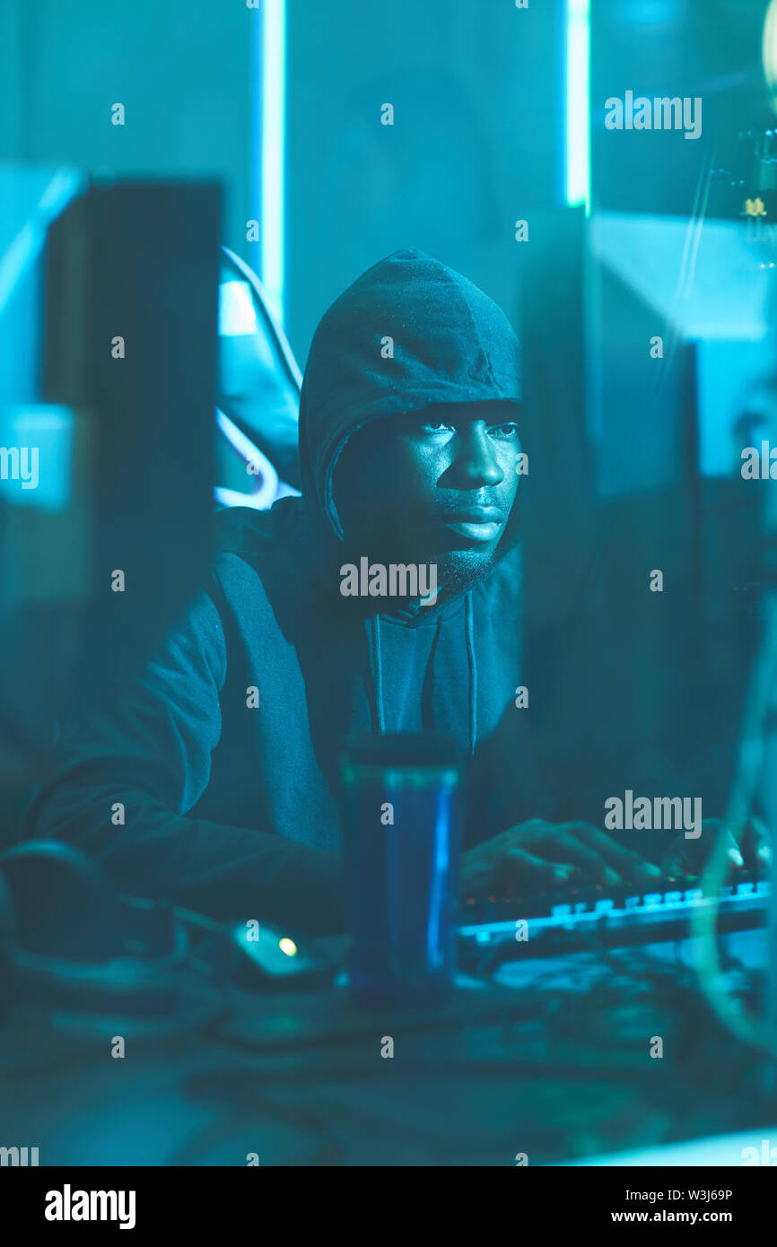 Tired hacker typing on keyboard hi-res stock photography and images - Alamy