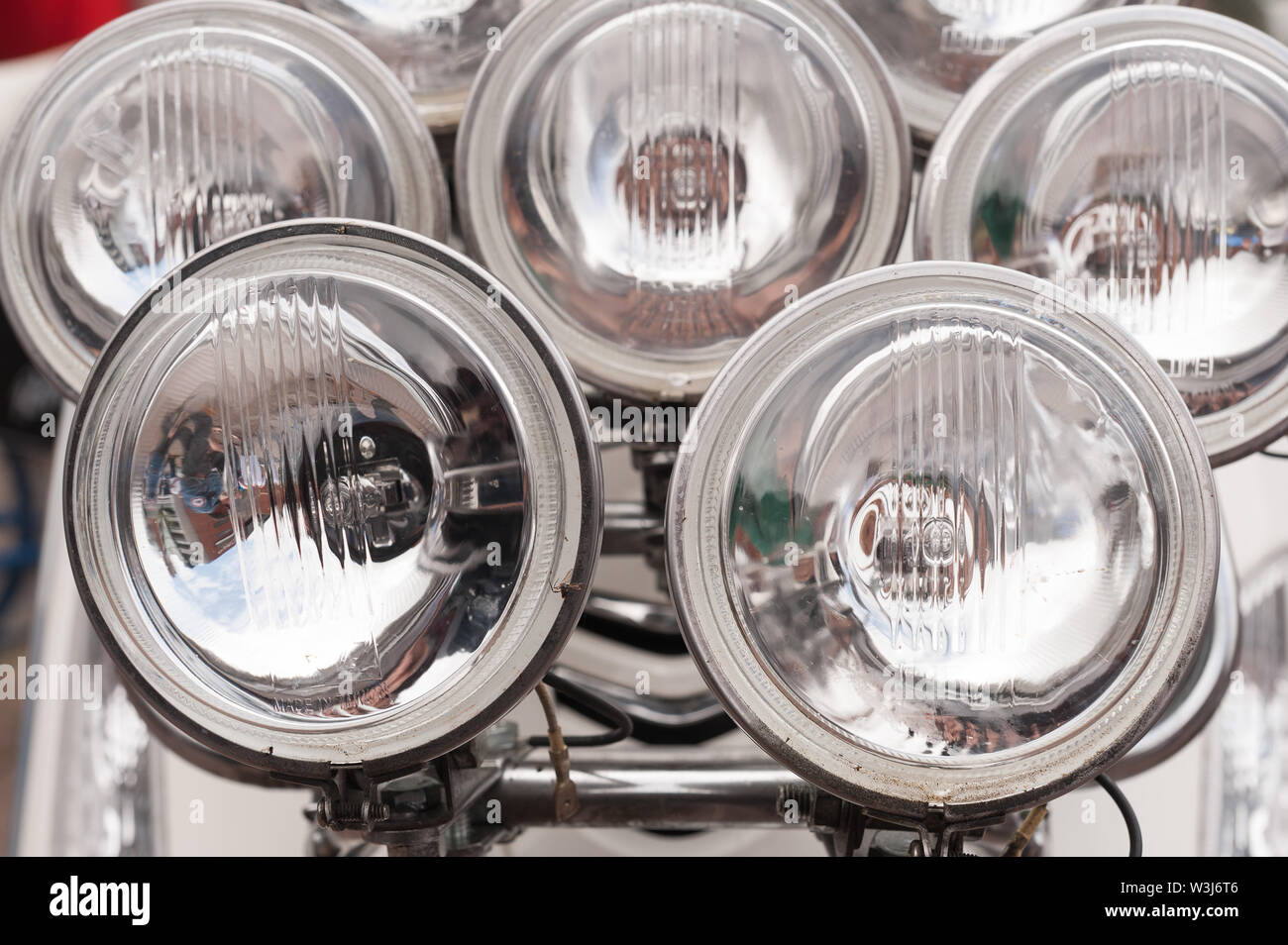 OTT, masses of motorbike headlights on the front of scooters used by ...