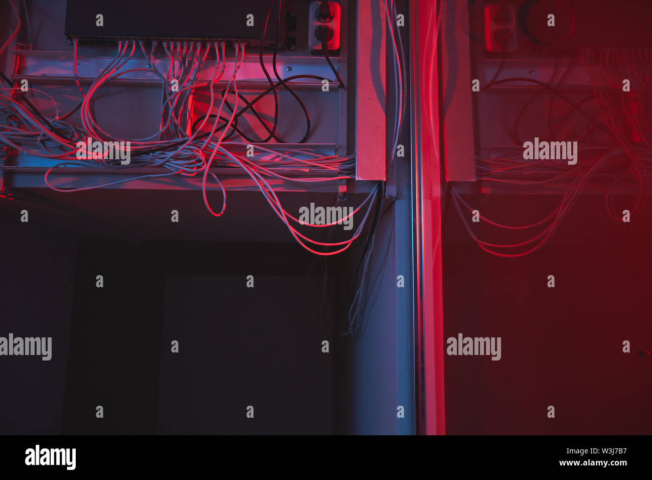 Close-up of network hardware hub with cables plugged into socket placed ...