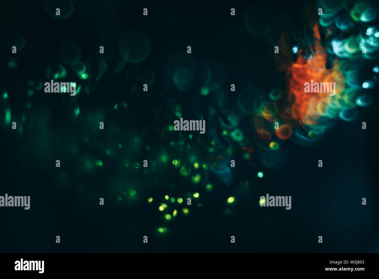 Beautiful colored bokeh on a dark abstract background Stock Photo - Alamy