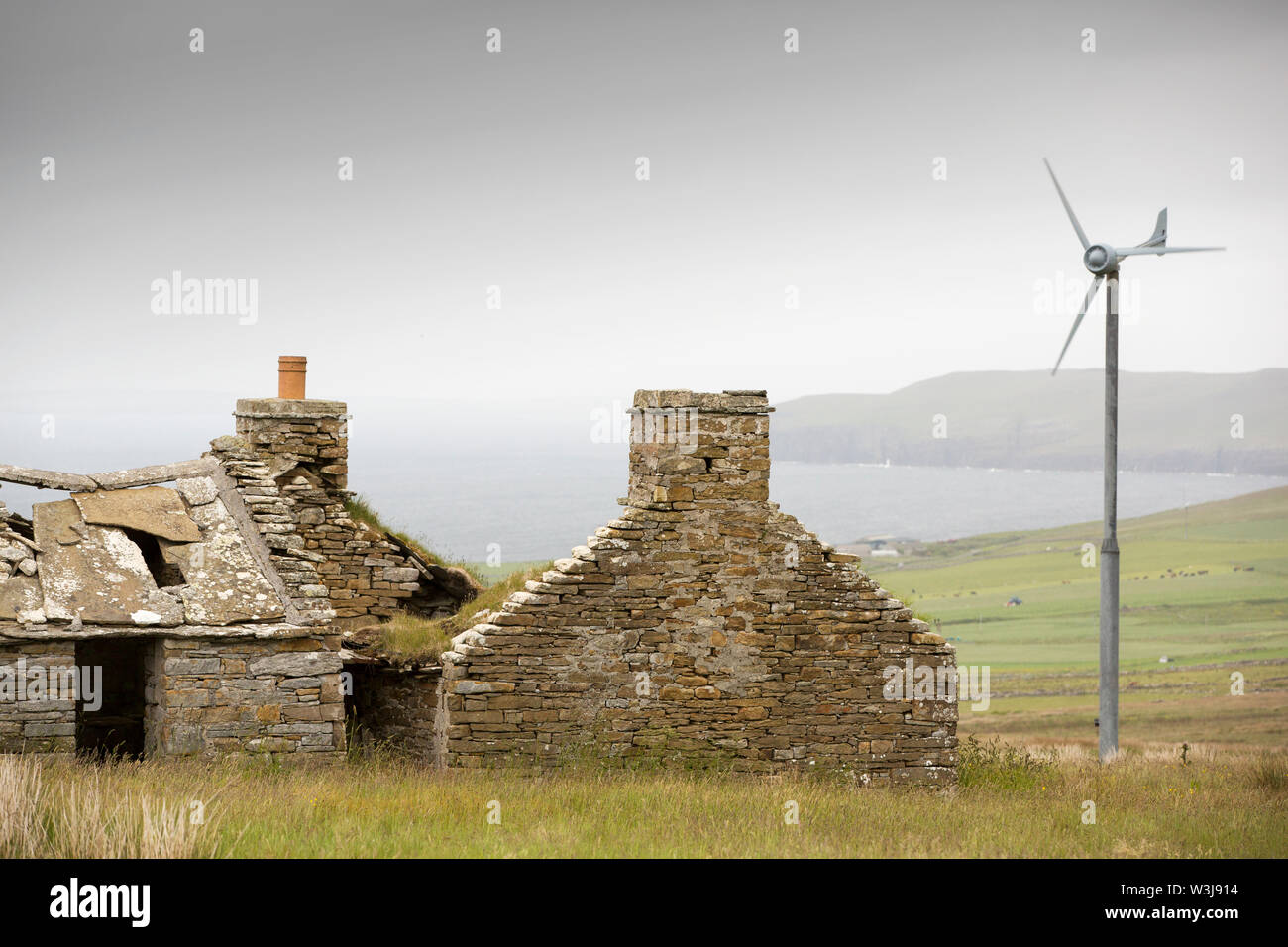 An abandoned croft with wind turbine on Rousay, Orkney Isles, Scotland ...