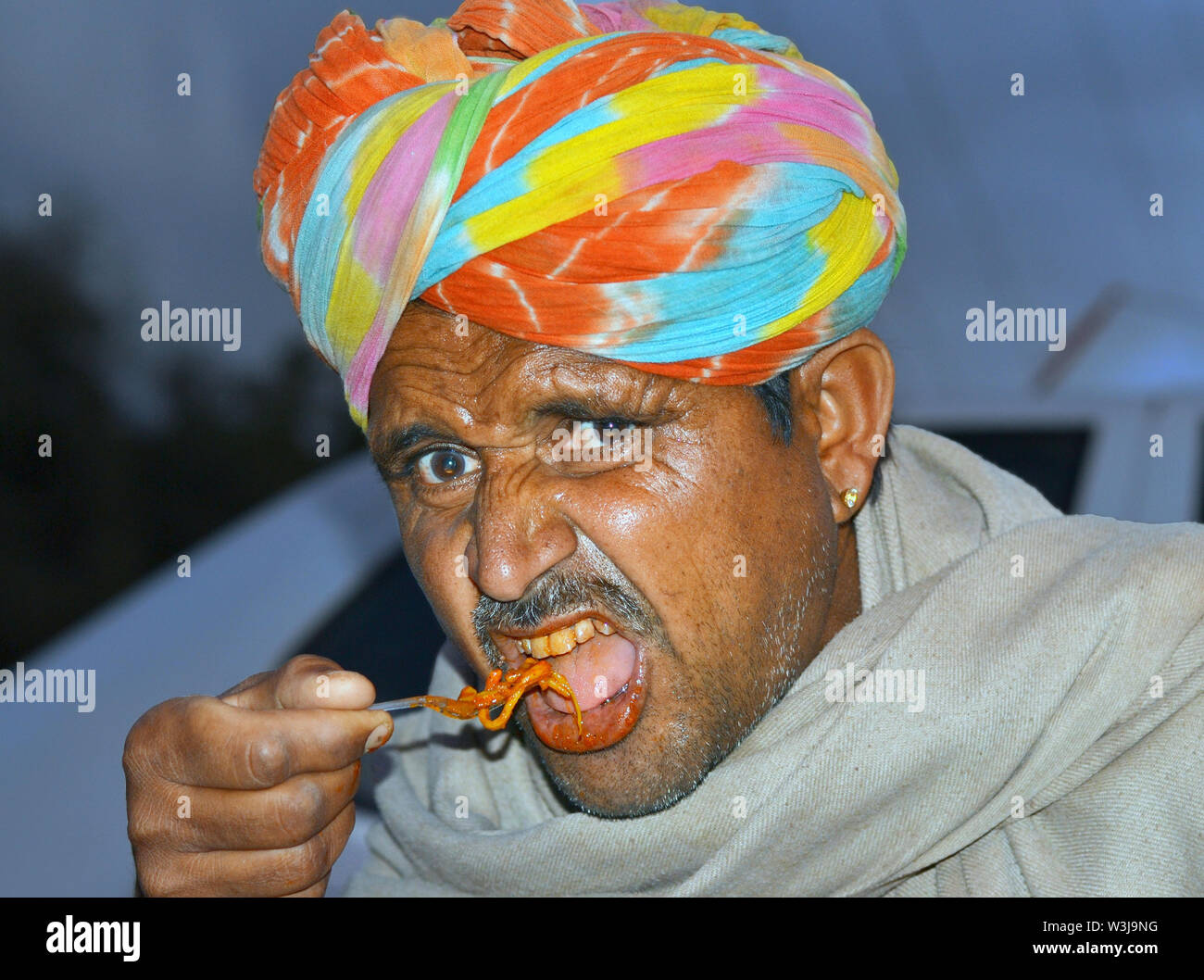 Man eating spicy food hi-res stock photography and images - Alamy