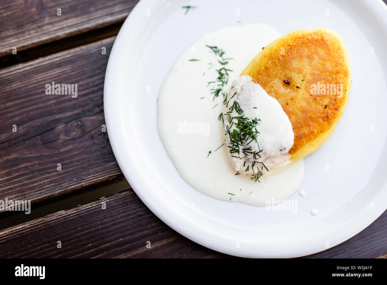 Meat-filled potato pancakes, traditional Lithuanian food on metal pann ...