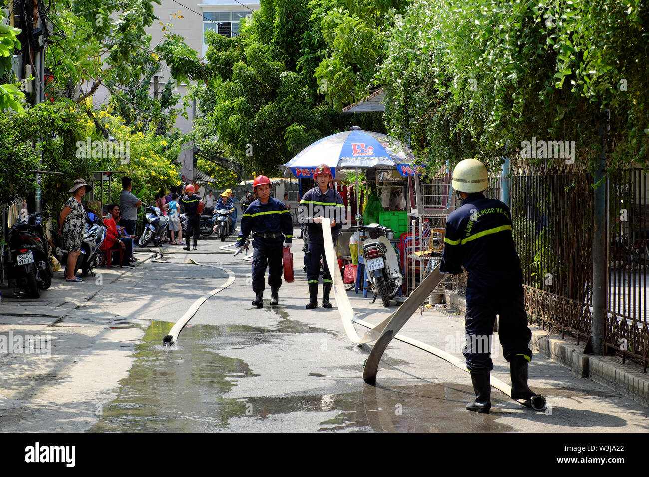 Vietnamese firefighter finish fire fighting training and bring tools ...