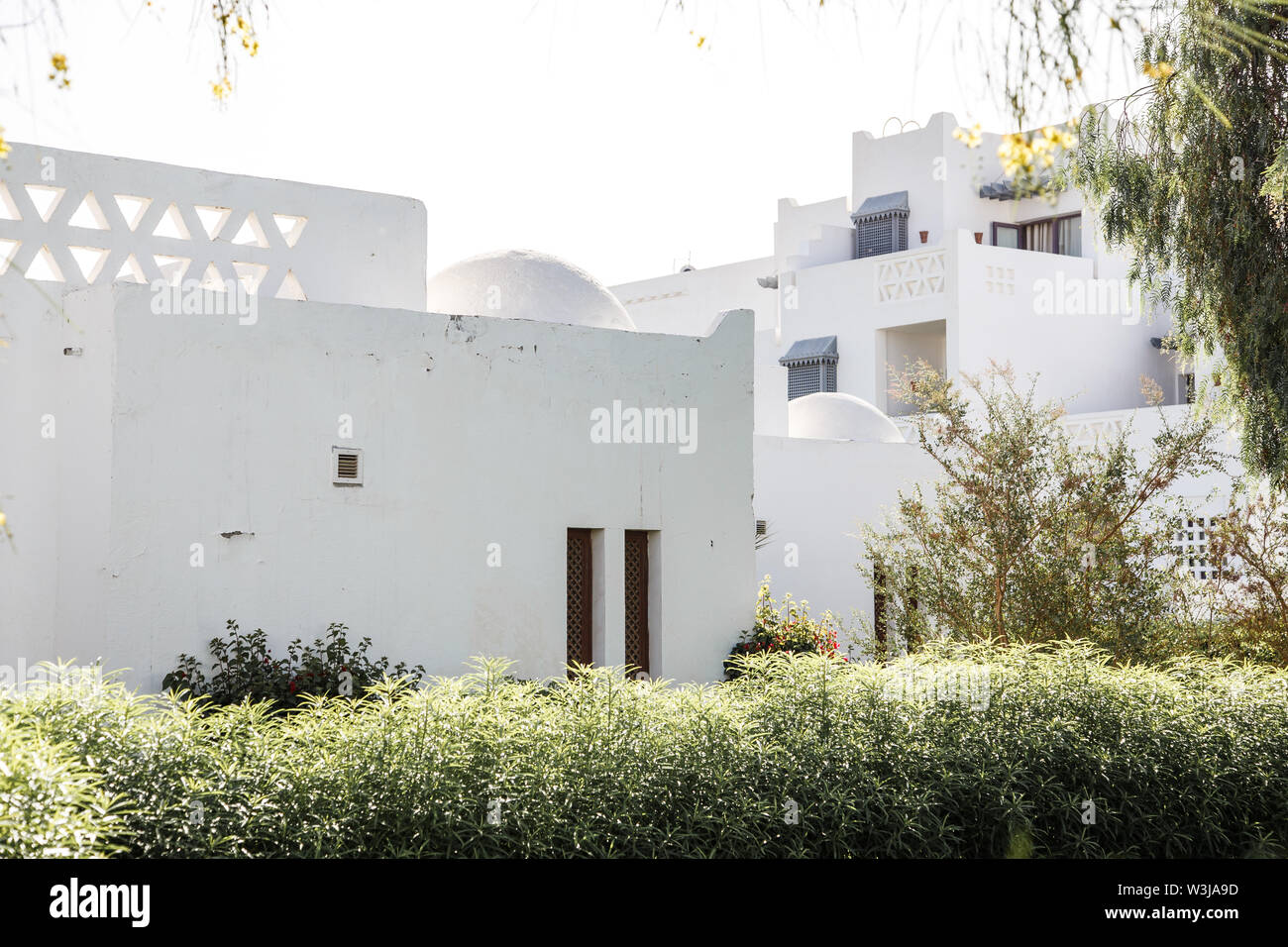 Modern white stone house in the Arab style. The concept of light and ...