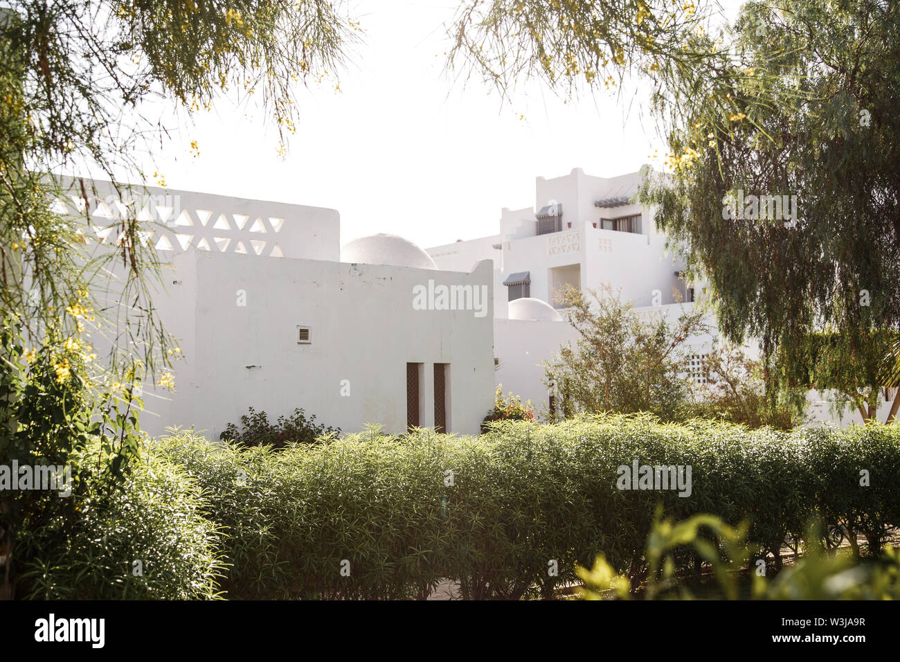 Modern white stone house in the Arab style. The concept of light and ...