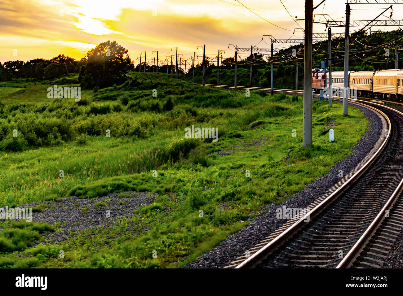 The train moves forward against the beautiful sunset Stock Photo - Alamy