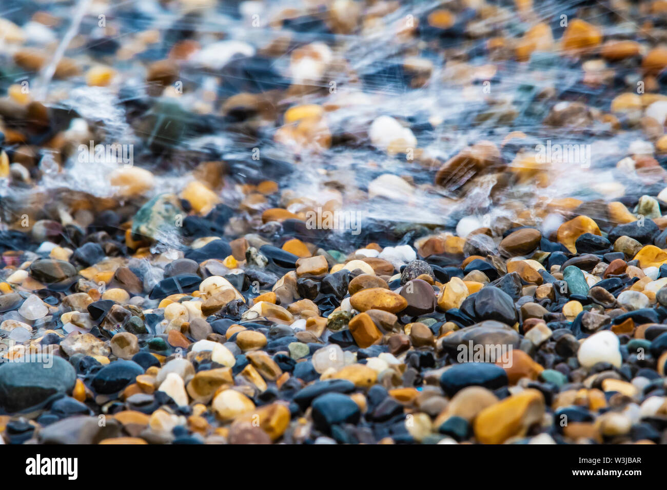 Abstract background with decorative floor pattern of sea gravel stones ...