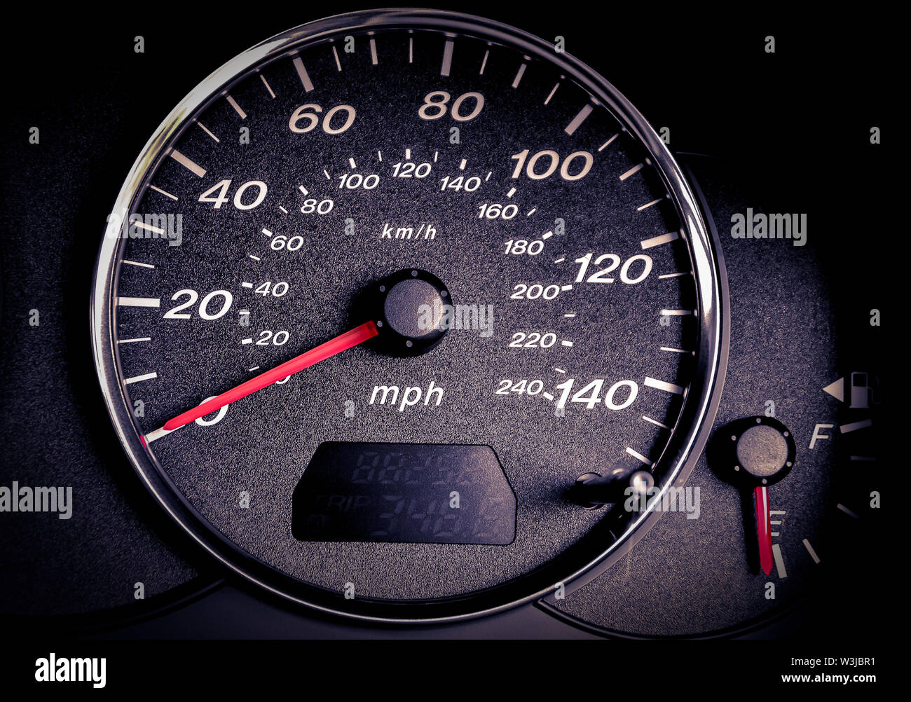 Close-up dashboard with speedometer and RPM Stock Photo - Alamy