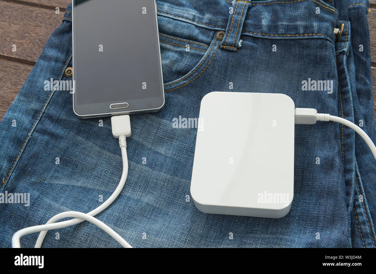 White power bank for charging mobile devices Stock Photo - Alamy