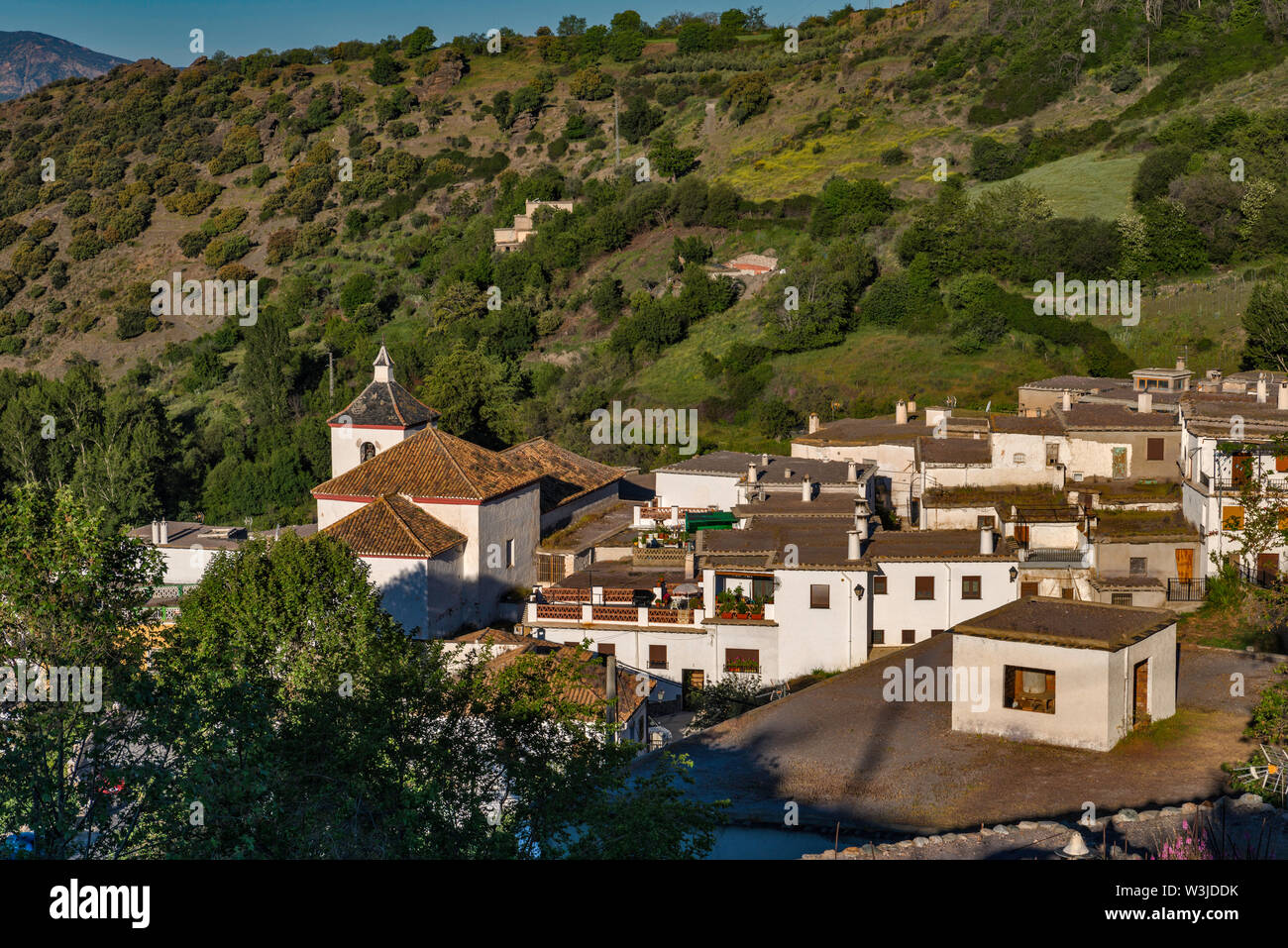 Mudejar style parish church, terraos, traditional houses with flat ...