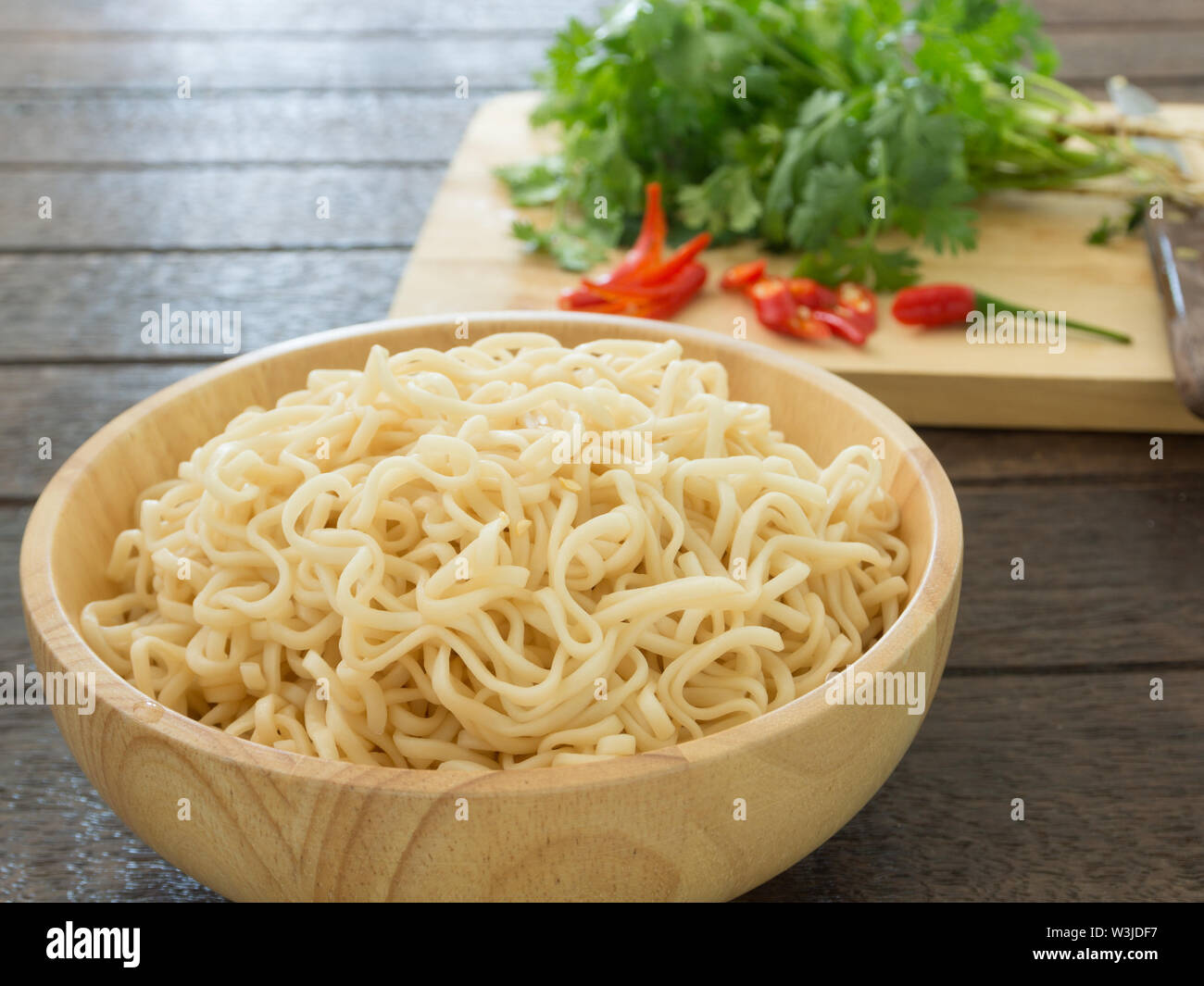 Instant noodles in bowls on wood table. top view Stock Photo - Alamy