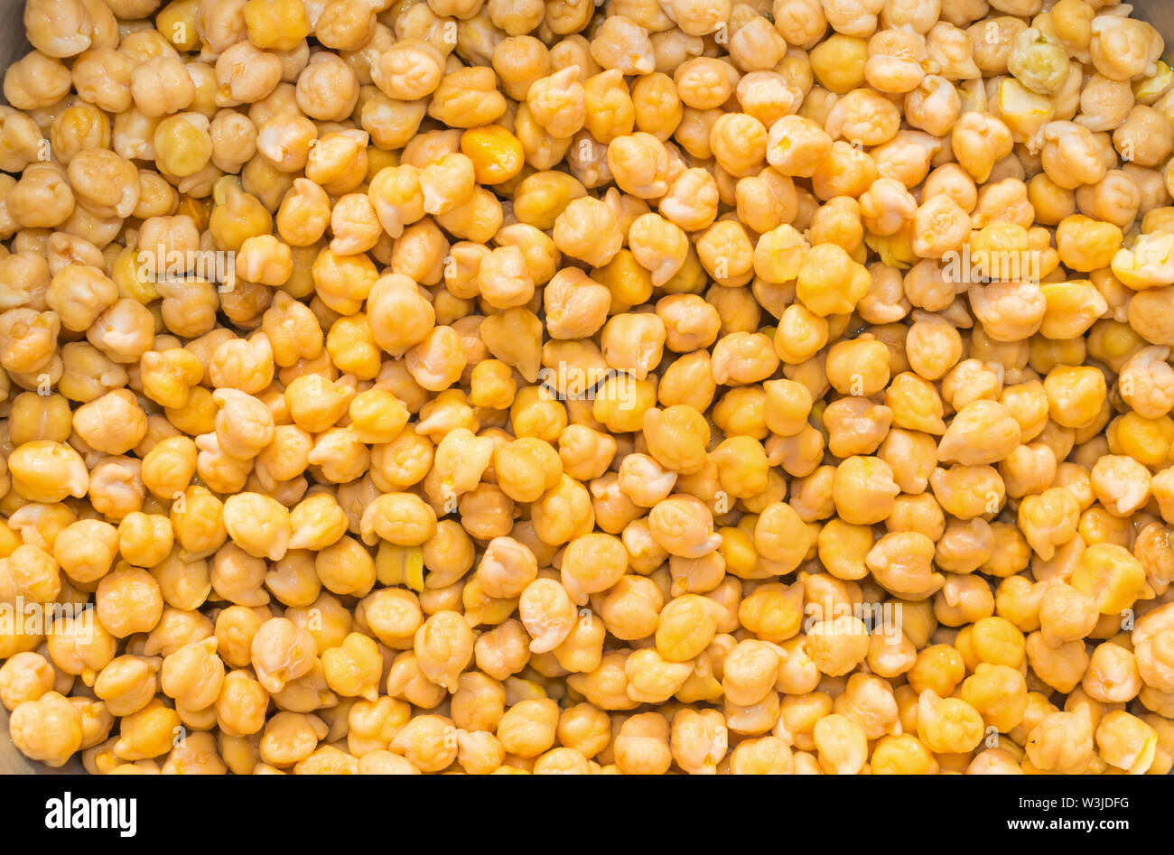close up of pile of yellow chick peas,pile of cooked kabuli chick peas ...