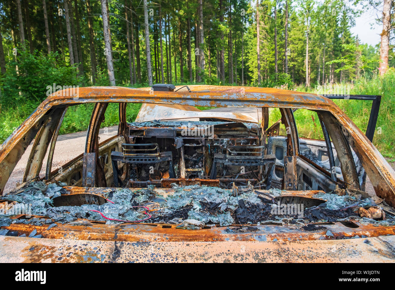Interior of a burned out car from behind at the roadside Stock Photo ...