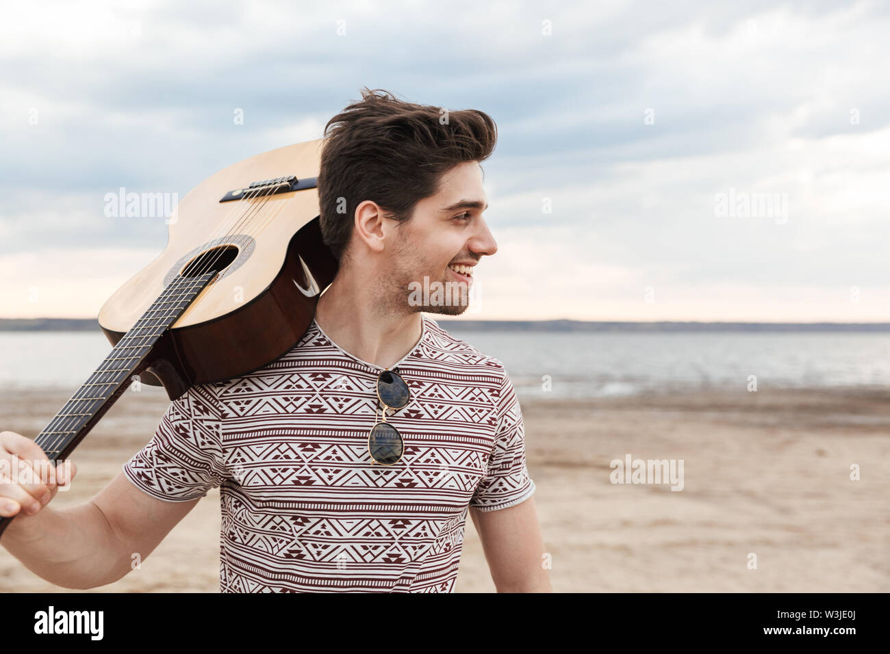 Man carrying guitar hi-res stock photography and images - Alamy