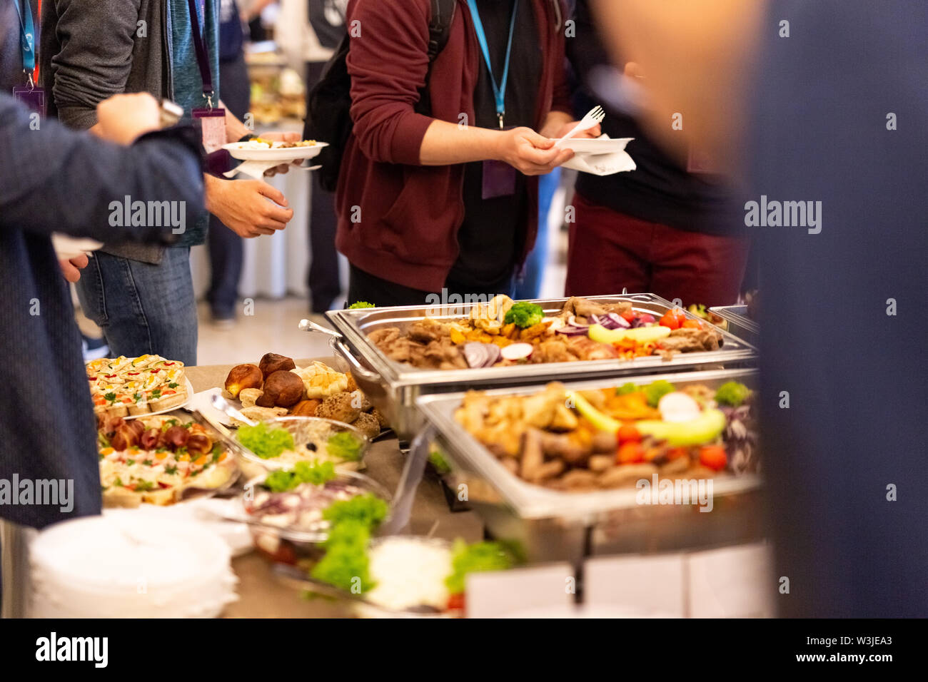 People enjoying buffet meal Stock Photo - Alamy