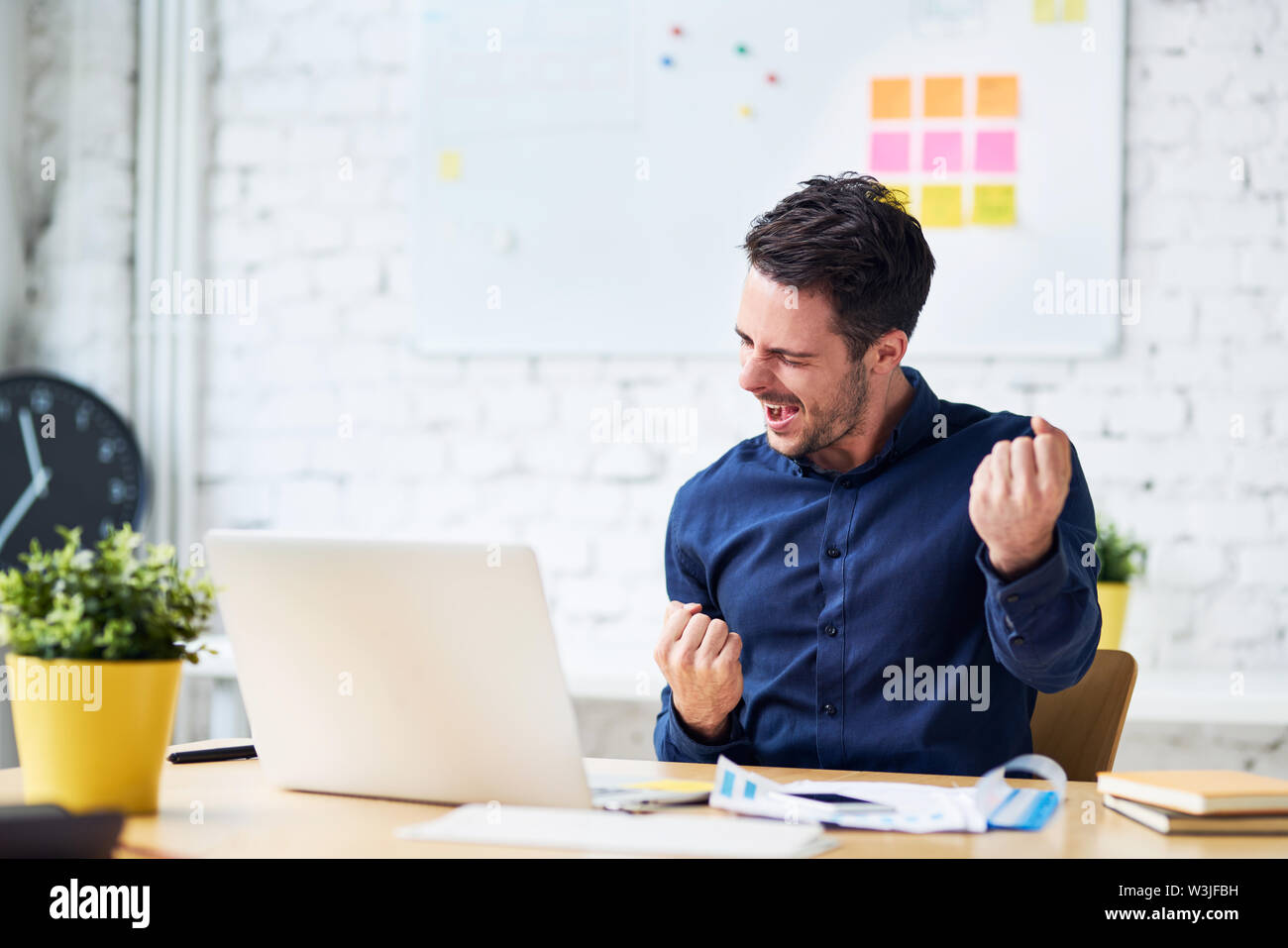 Man celebrating success gesture in hi-res stock photography and images ...