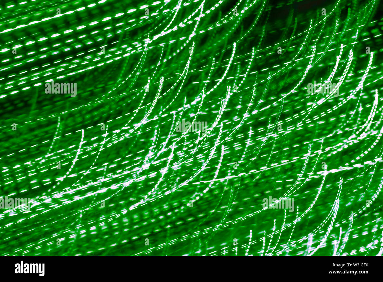 abstract background. white broken lines on green Stock Photo - Alamy