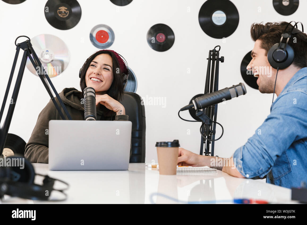 Image of a handsome young man radio host with colleague woman at the ...