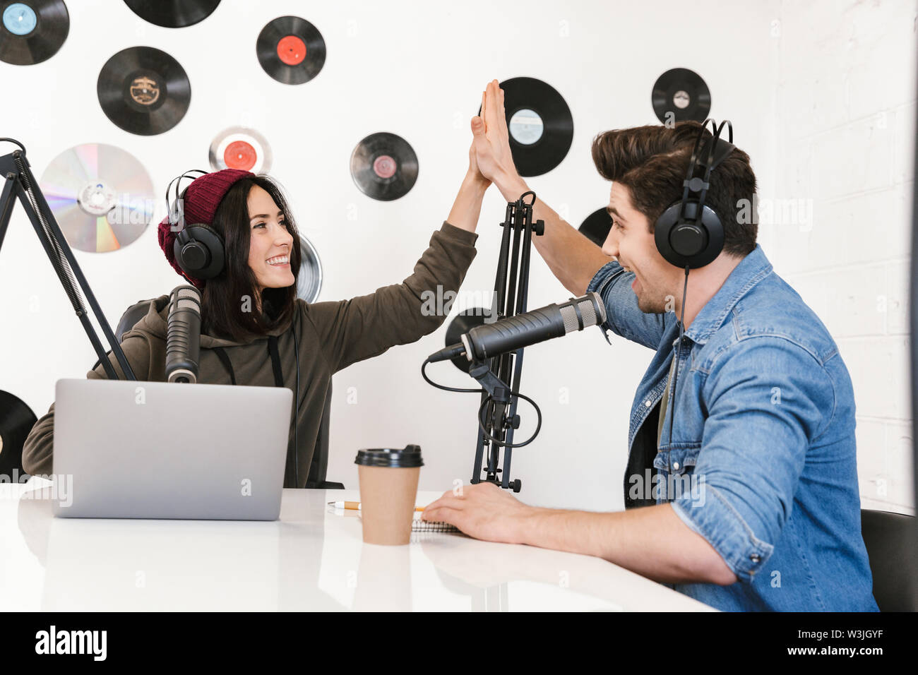 Image of a handsome young man radio host with colleague woman at the ...