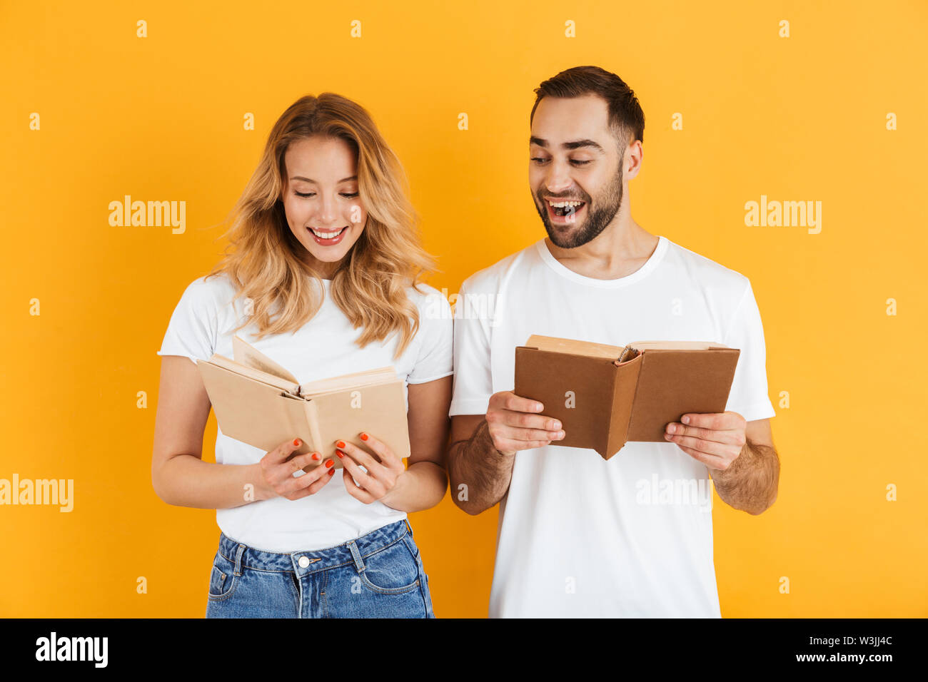 Image of attractive couple man and woman expressing interest while ...