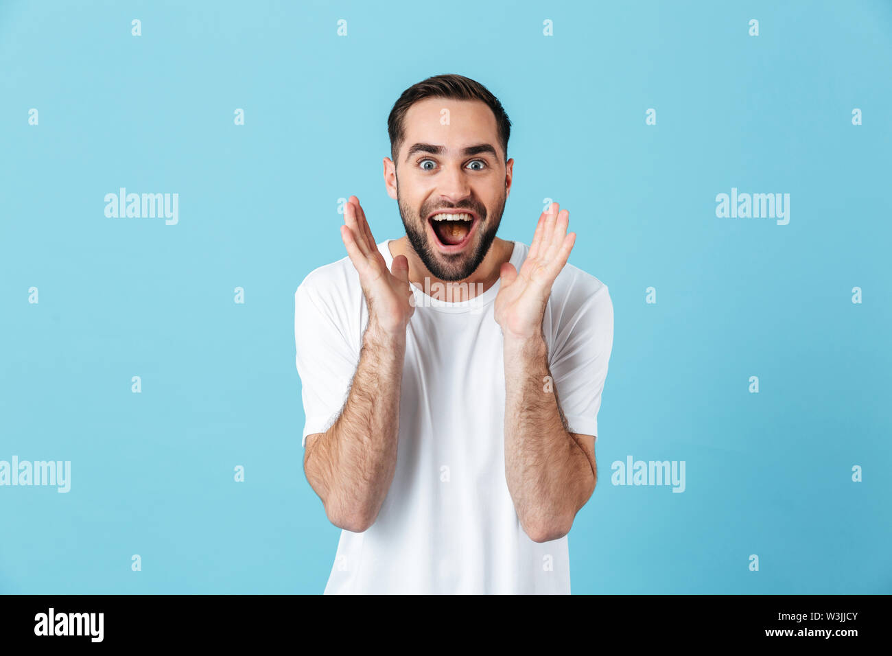 Image of excited young screaming happy bearded man posing isolated over ...