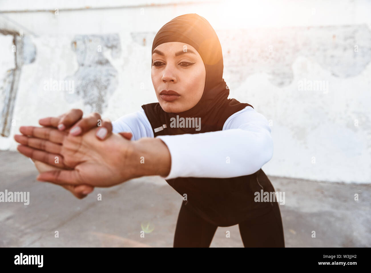 Picture of a young beautiful strong muslim sports fitness woman dressed ...