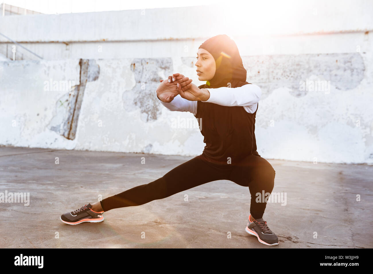 Picture of a young beautiful strong muslim sports fitness woman dressed ...