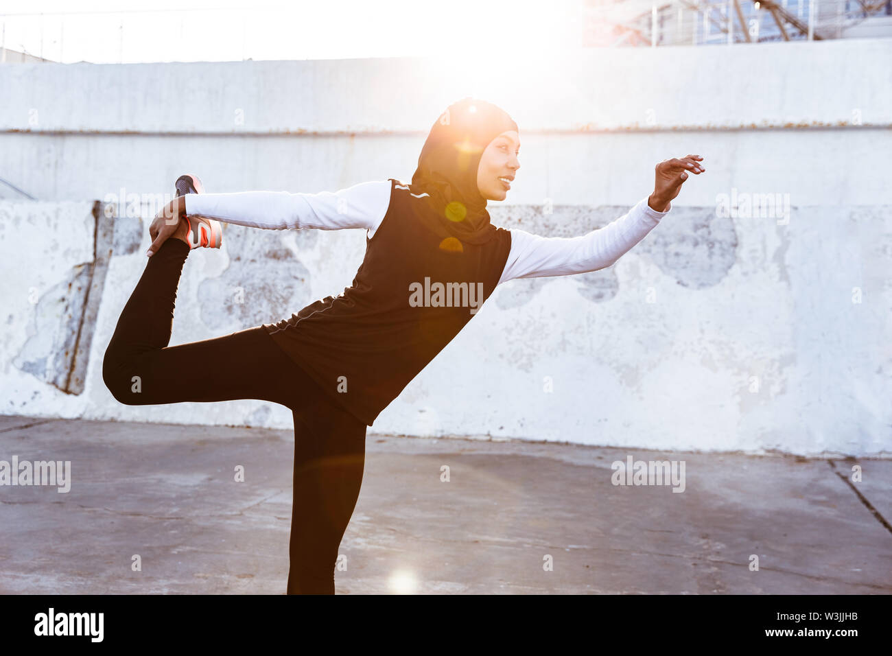 Picture of a young beautiful strong muslim sports fitness woman dressed ...
