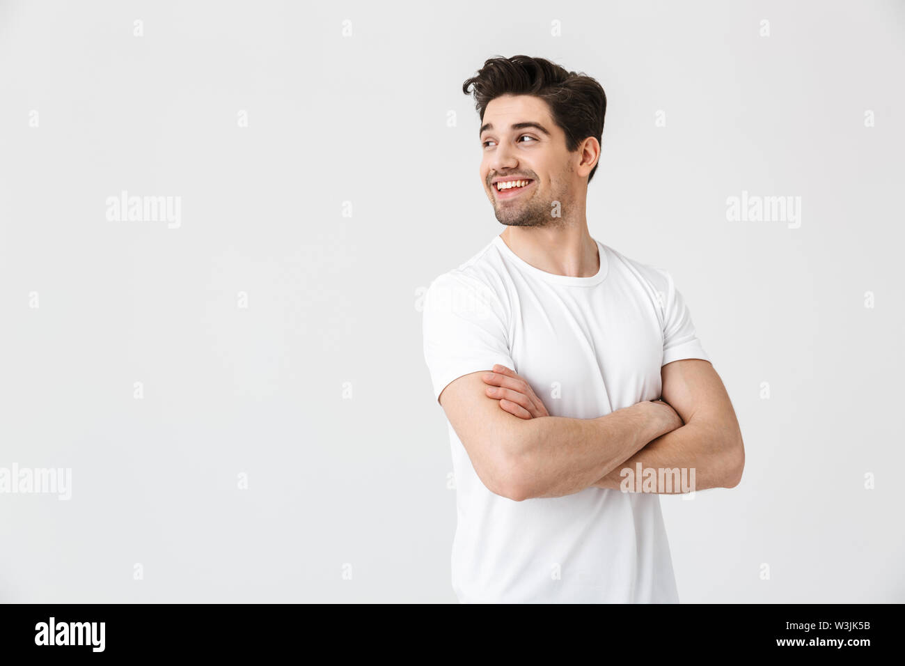 Image of a happy young excited emotional man posing isolated over white ...