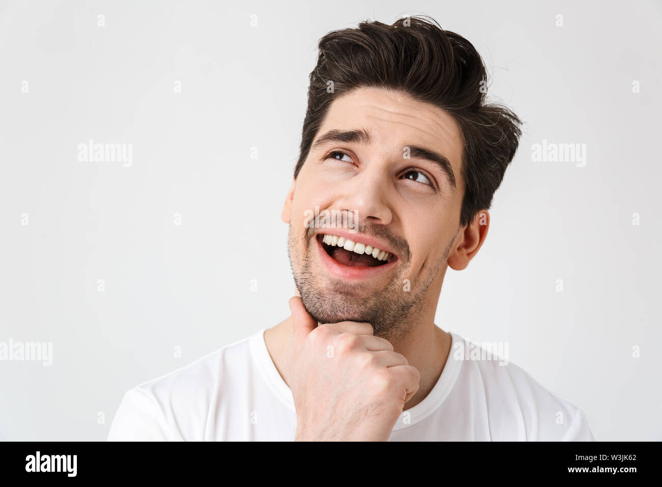 Image of a happy young excited emotional man posing isolated over white ...