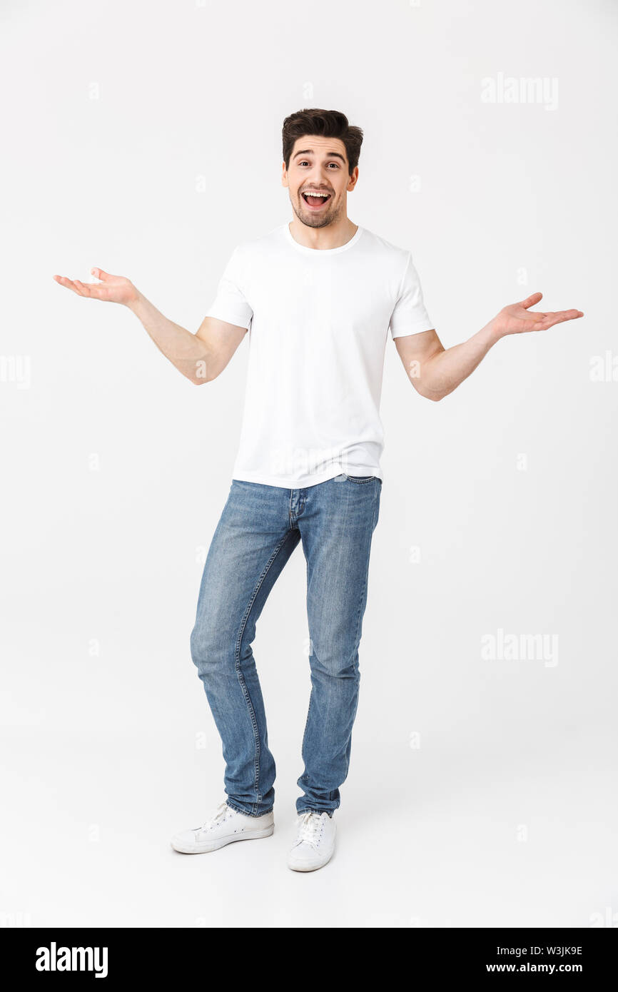 Image of a happy young excited emotional man posing isolated over white ...