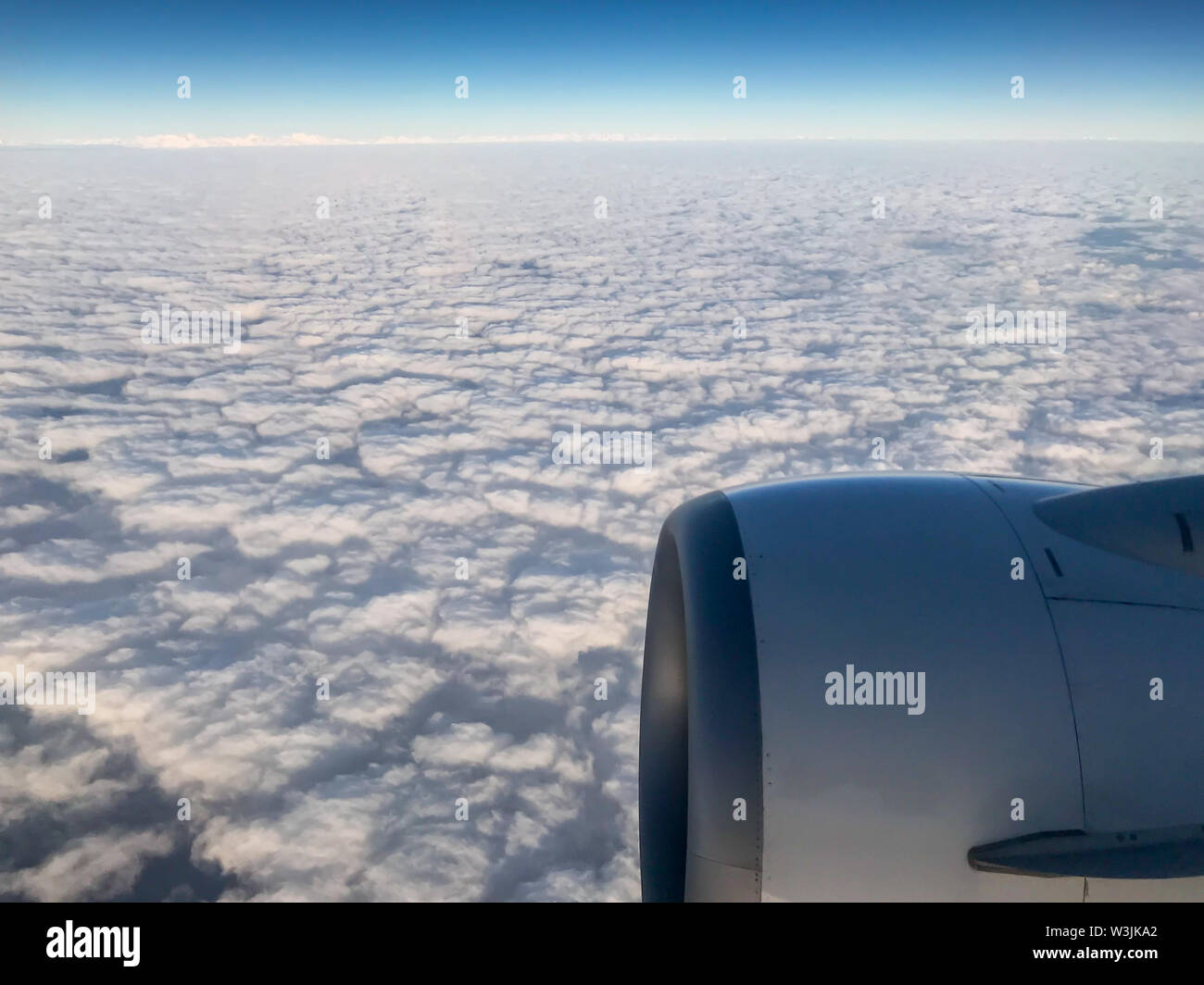 Flying clouds plane engine hi-res stock photography and images - Alamy