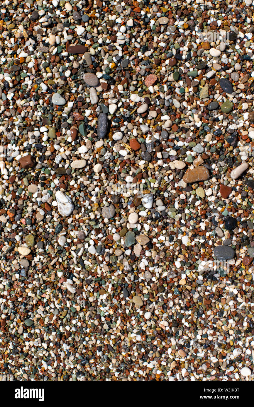 The texture of the beach with coarse sand. The texture of the pebble ...