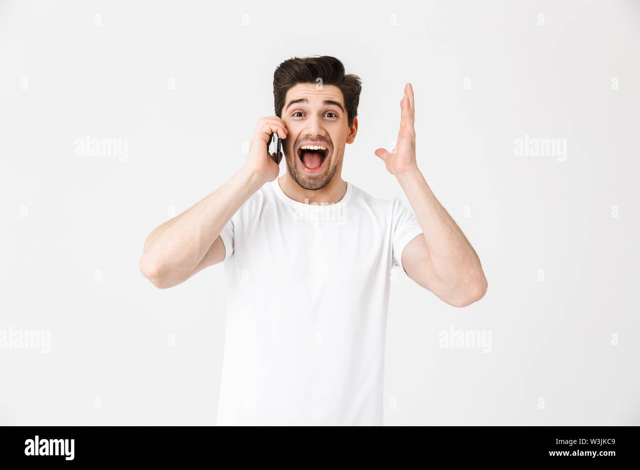 Image of happy excited shocked young man posing isolated over white ...