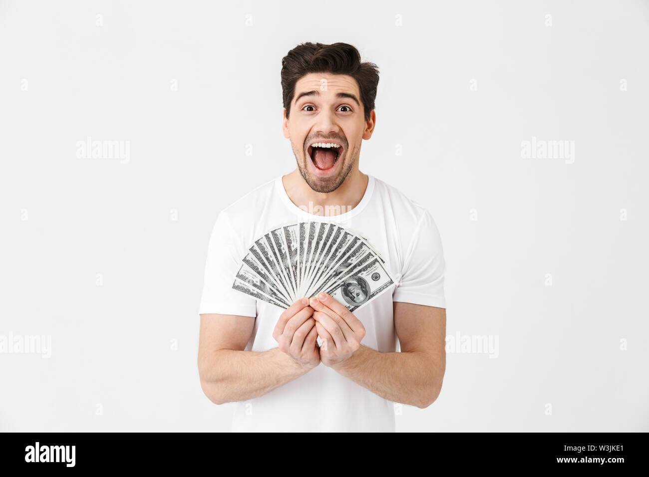 Image of shocked excited happy young man posing isolated over white ...
