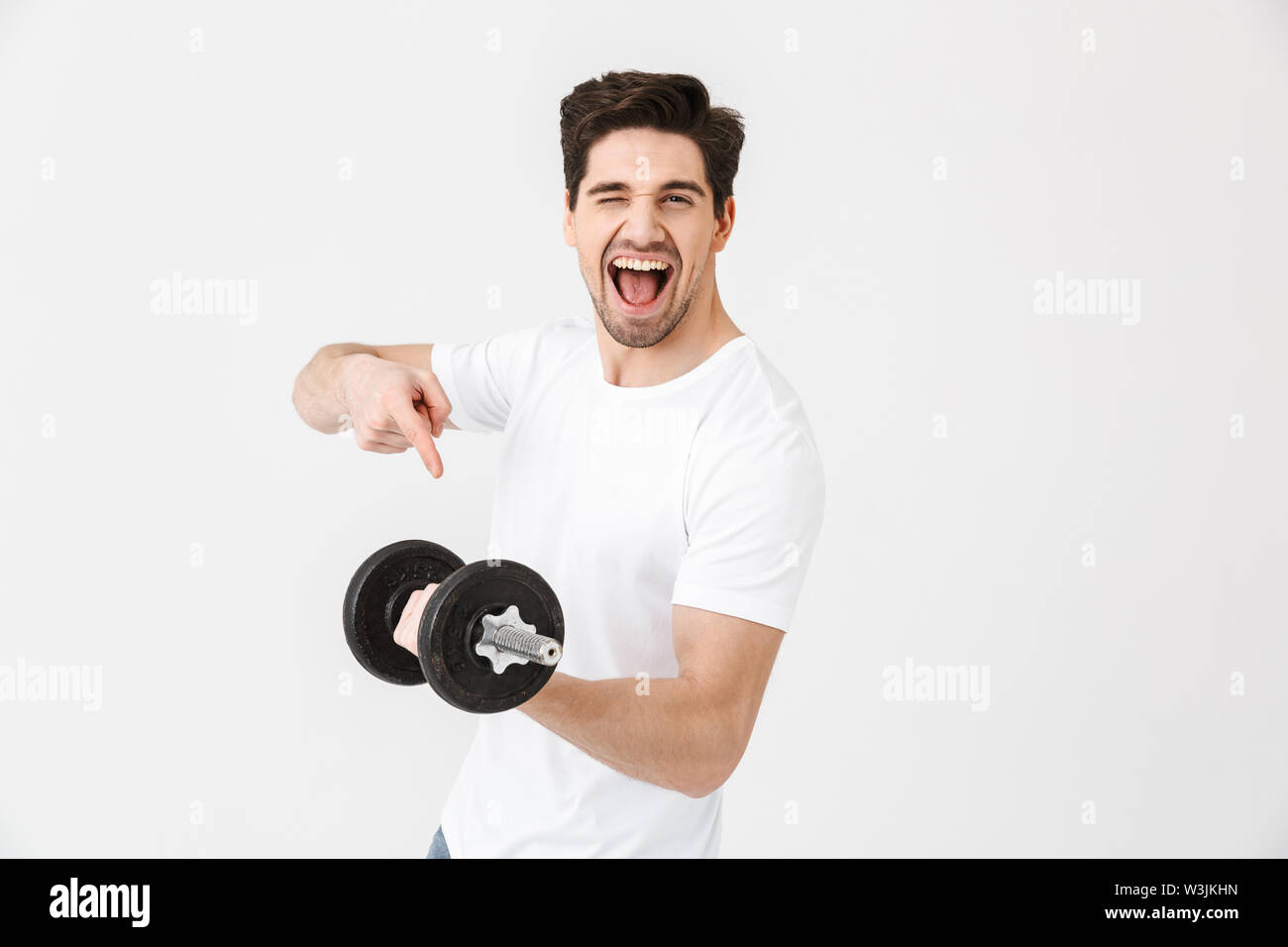 Image of emotional happy excited young man posing isolated over white ...