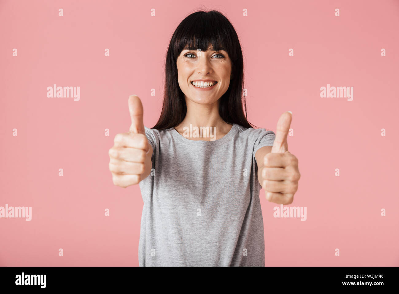 Image of a beautiful amazing happy woman posing isolated over light ...