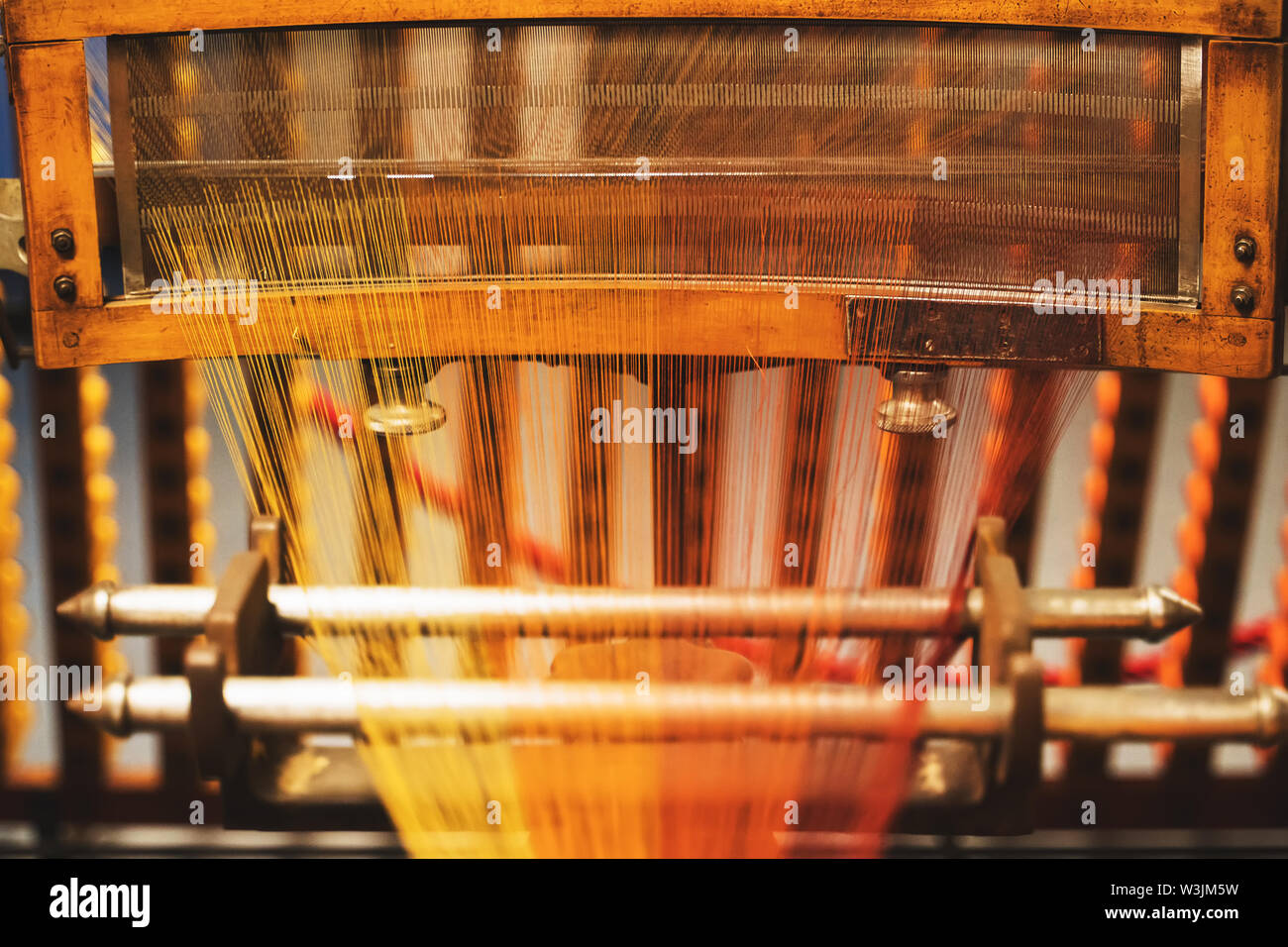 Very old loom machine with colored threads Stock Photo - Alamy