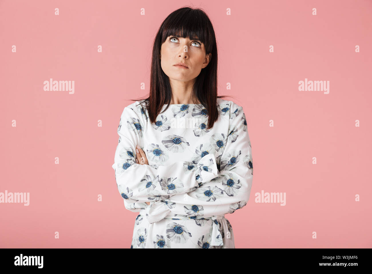 Image of a beautiful amazing thinking serious woman posing isolated ...