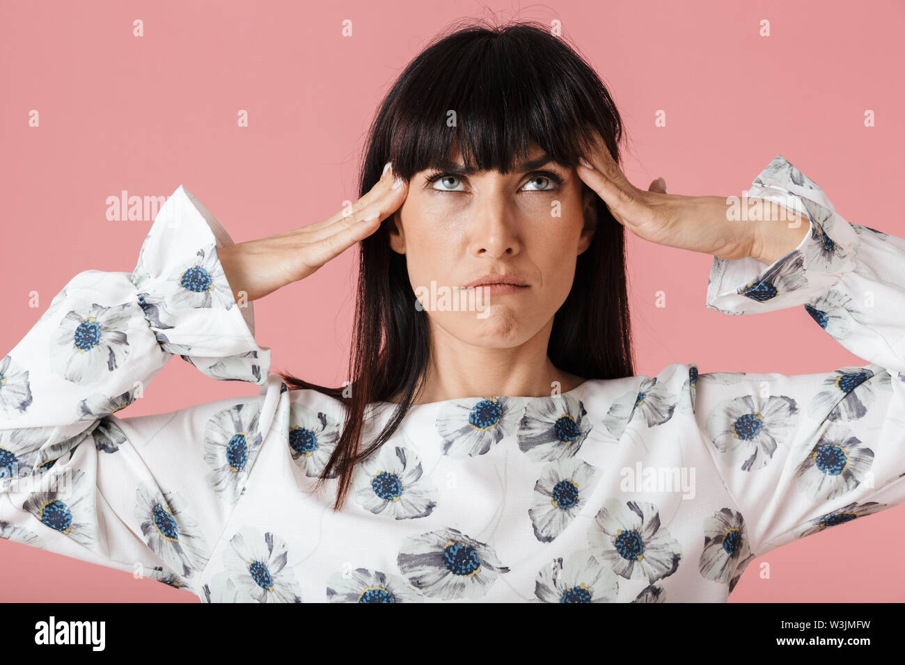 Image of a beautiful amazing thinking serious woman with headache ...