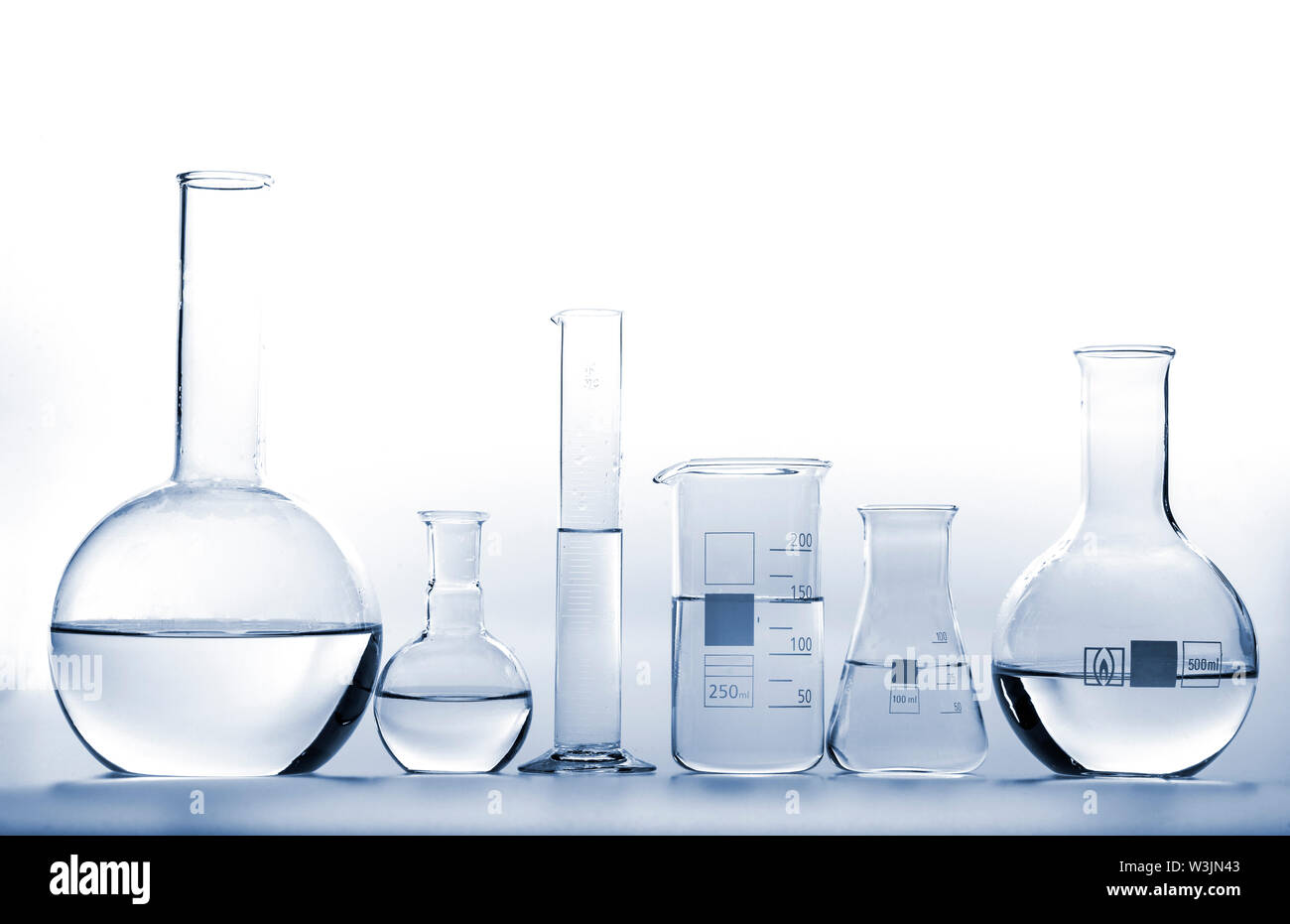 Test-tubes with reflections on a white and blue background. Laboratory ...