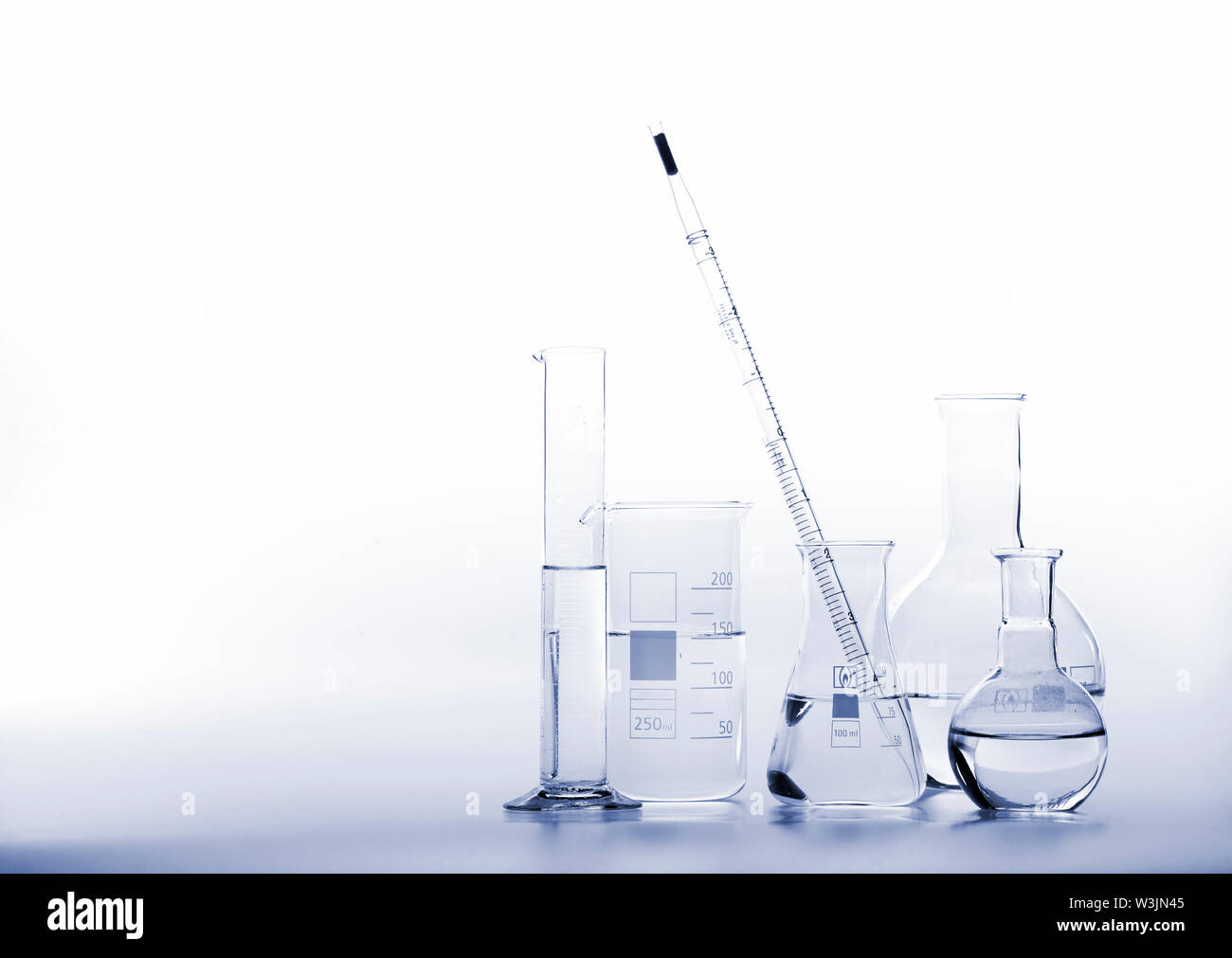 Test-tubes with reflections on a white and blue background. Laboratory ...