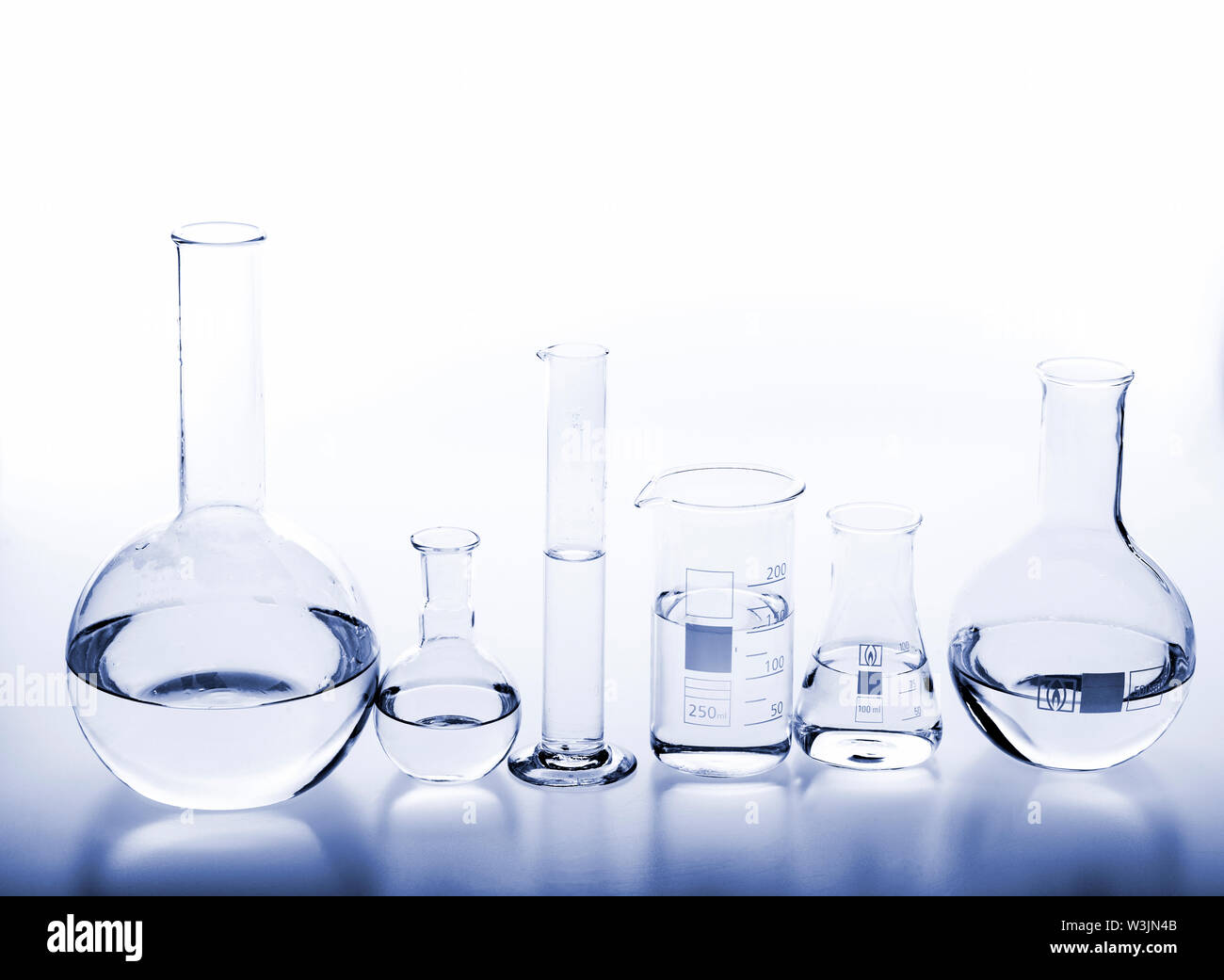 Test-tubes with reflections on a white and blue background. Laboratory ...