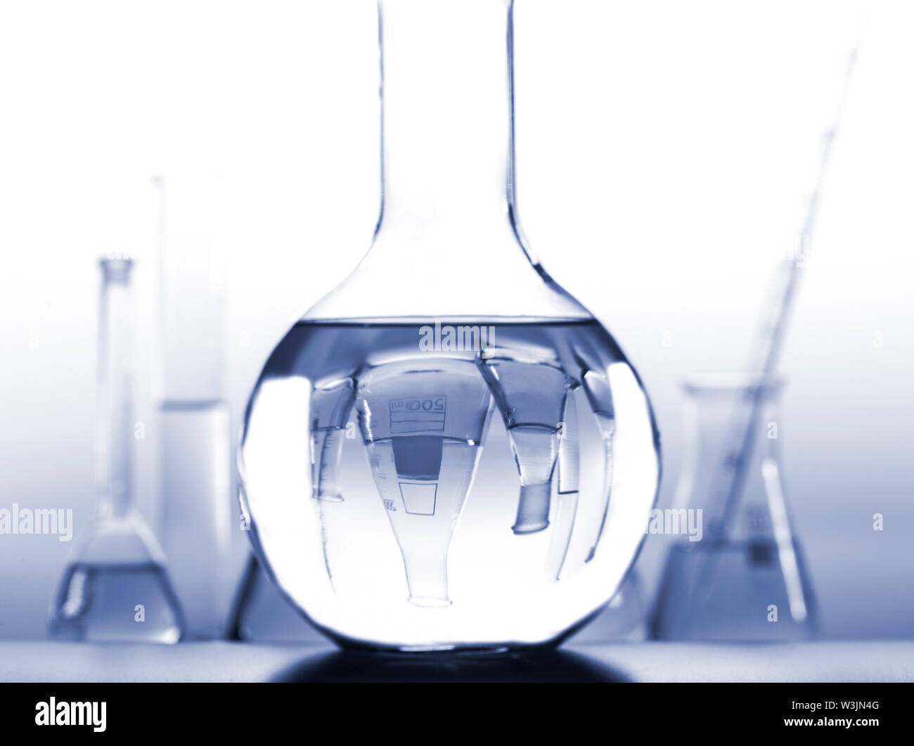 Test-tubes with reflections on a white and blue background. Laboratory ...