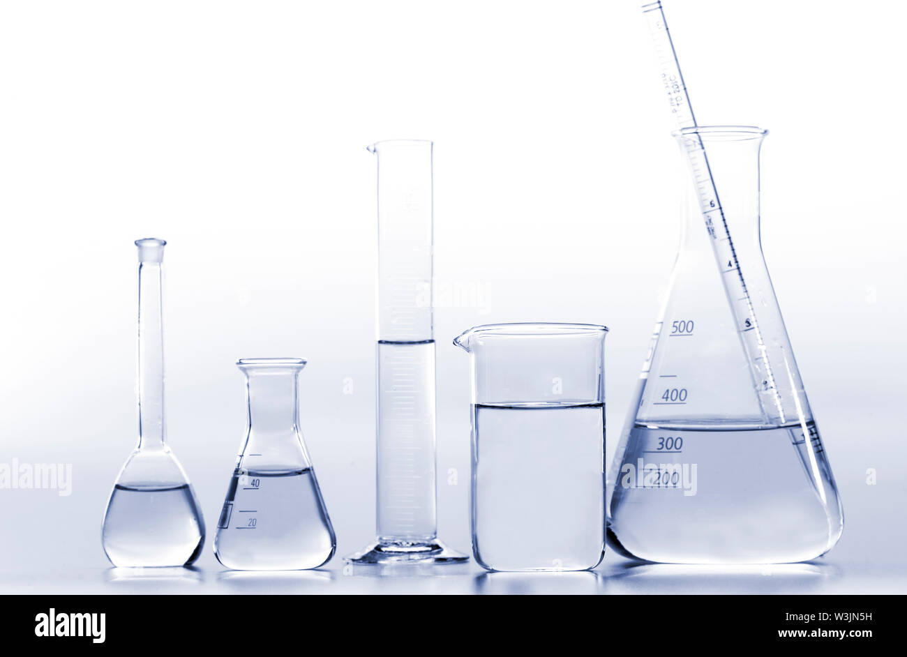 Test-tubes with reflections on a white and blue background. Laboratory ...