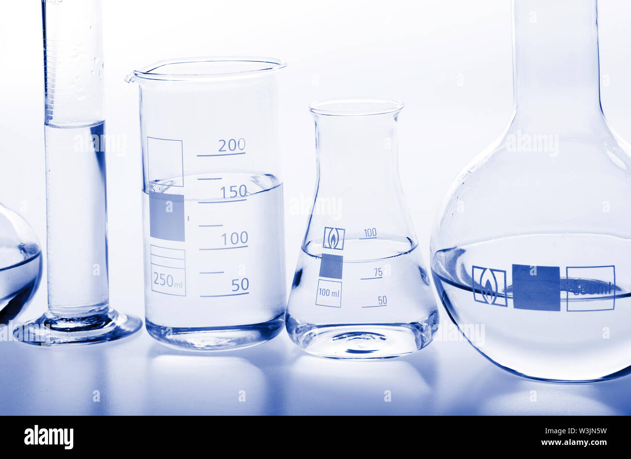 Test-tubes with reflections on a white and blue background. Laboratory ...