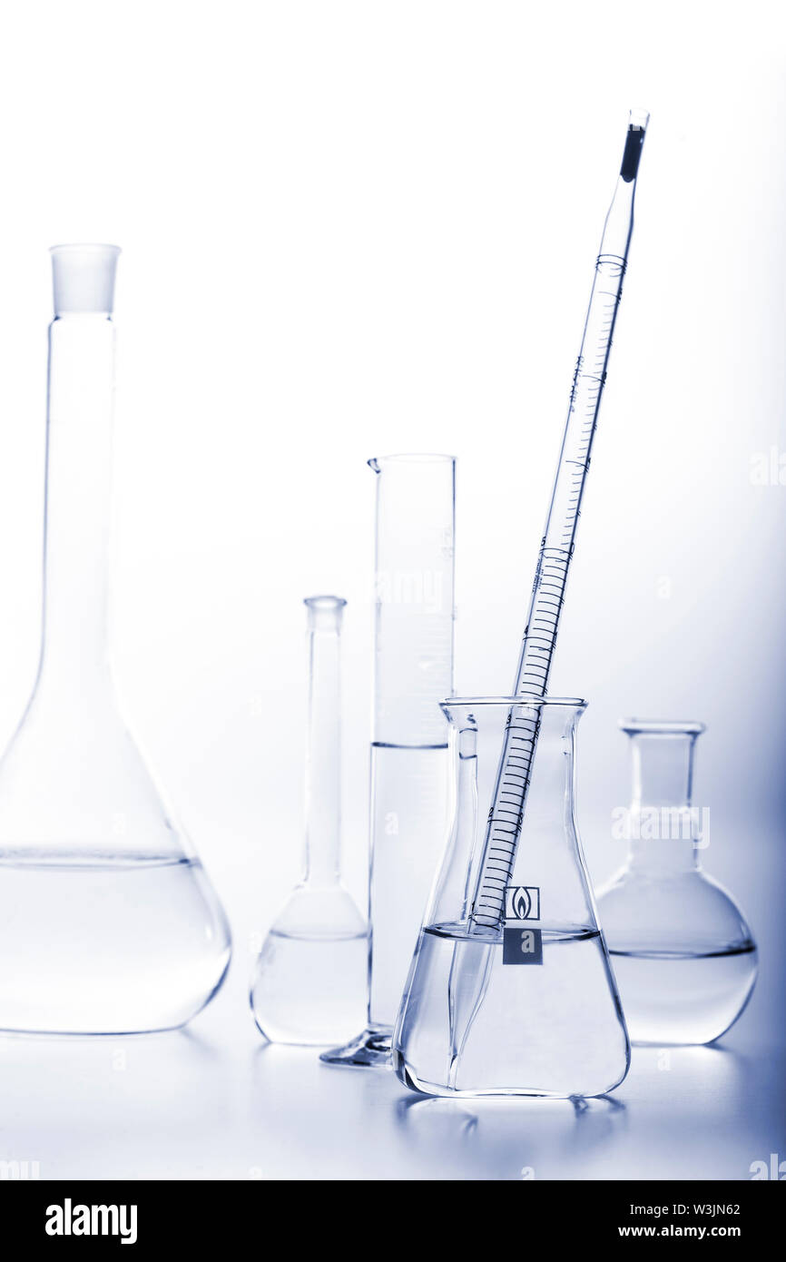 Test-tubes with reflections on a white and blue background. Laboratory ...